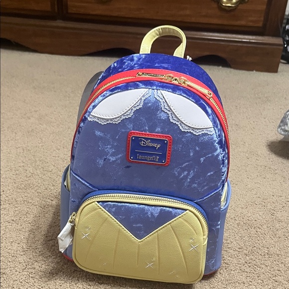 Loungefly | Bags | Snow White Loungefly Backpack In Blue And Yellow ...
